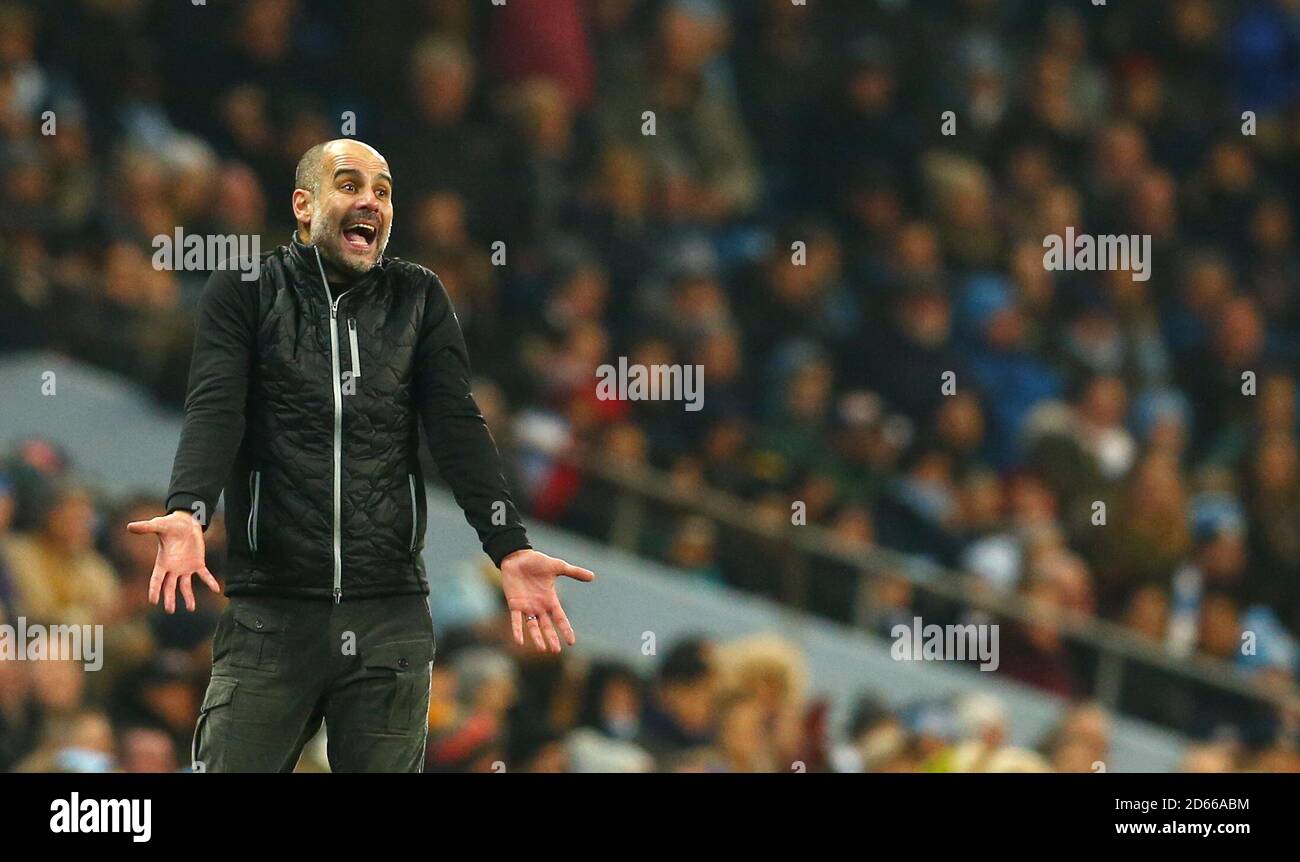 Manchester City manager Pep Guardiola gestures on the touchline Stock ...