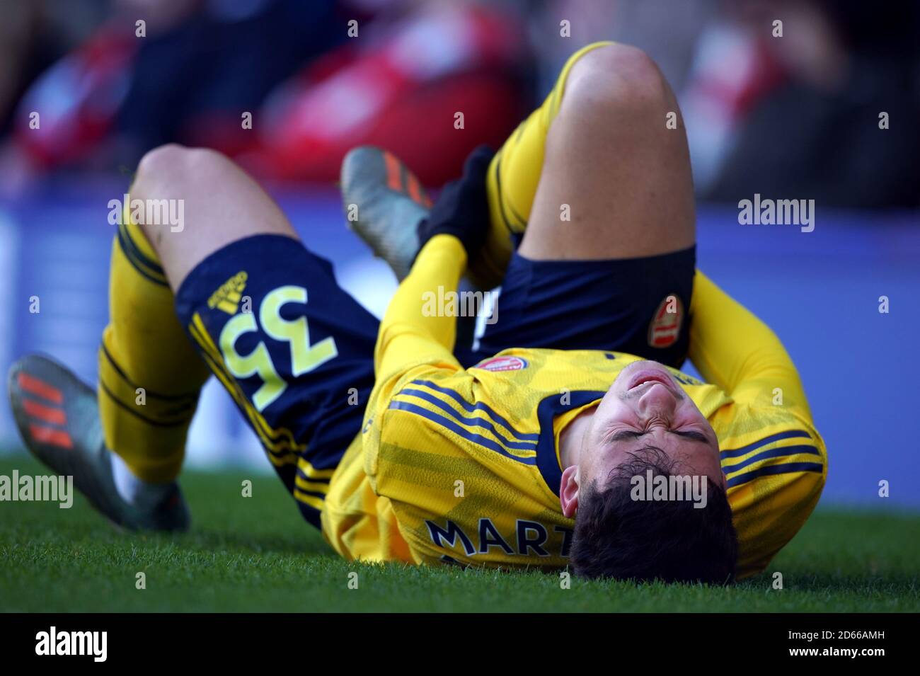Arsenal's Gabriel Martinelli lies on the pitch injured Stock Photo - Alamy