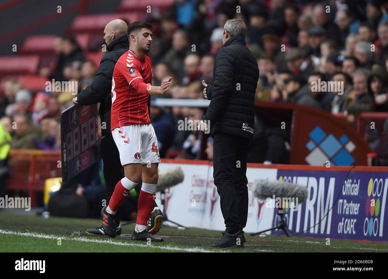 Charlton Athletic's Aaron Henry shakes hands with manager Lee Bowyer as ...