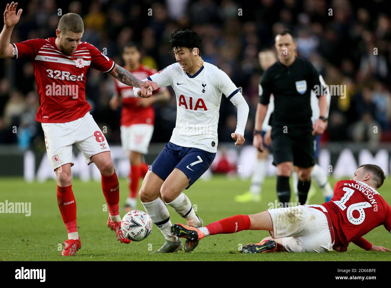 Middlesbrough's Jonny Howson (left) and Adam Clayton tackle Tottenham ...