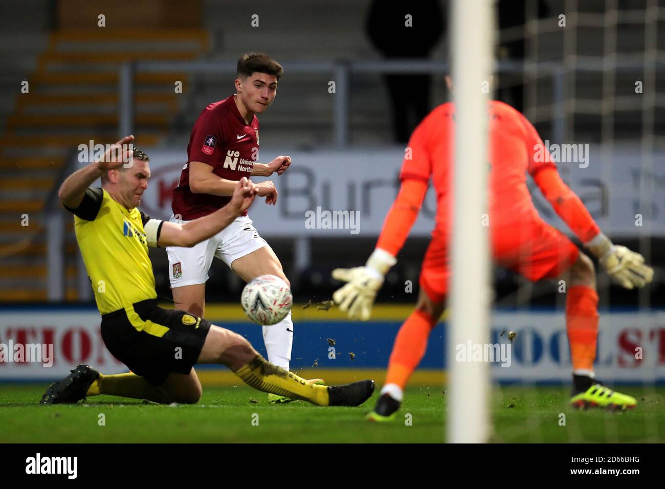 Northampton Town's Scott Pollock (centre) takes a shot on goal Stock ...