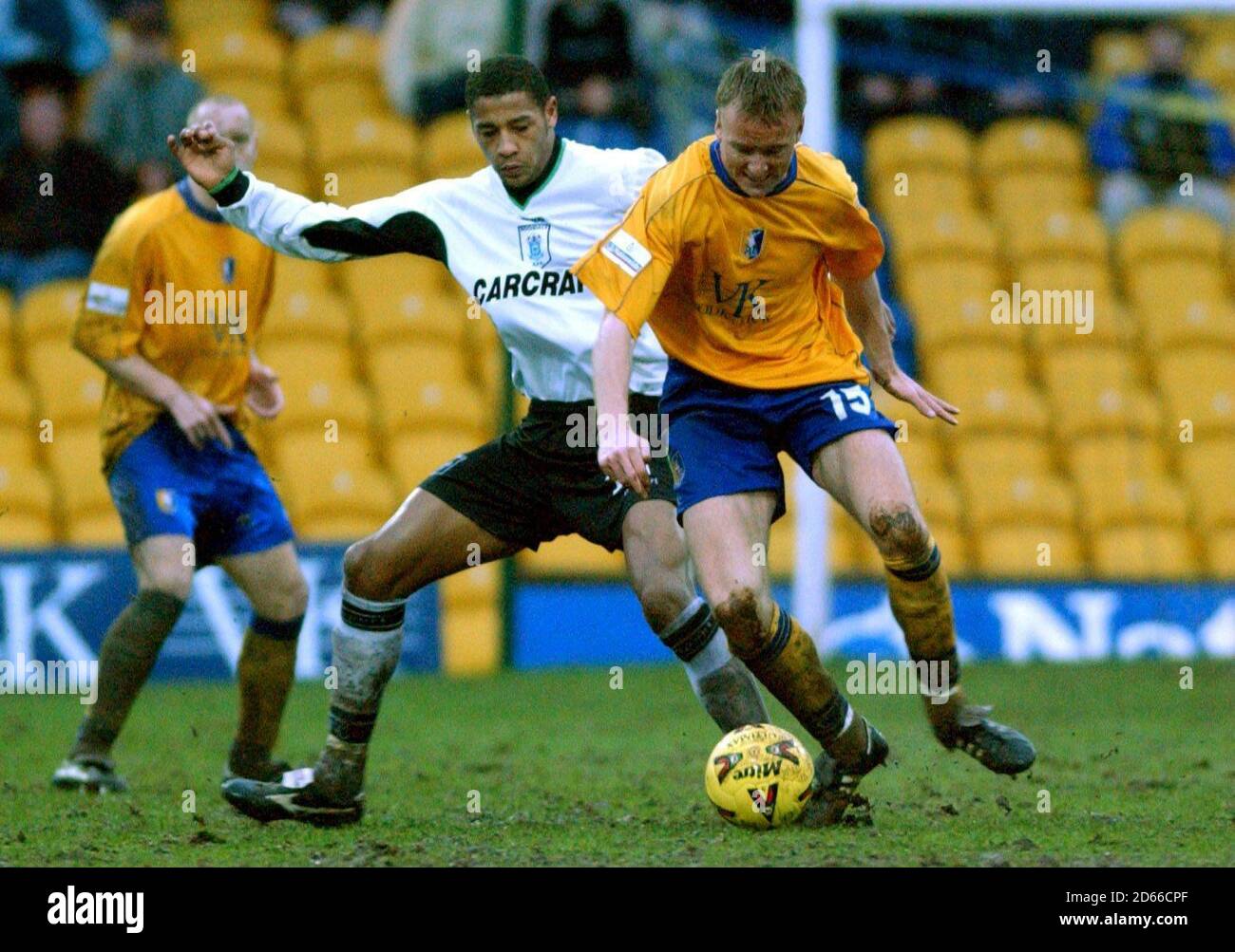 l-r; Rochdale's Clive Platt battles for possession of the ball with ...