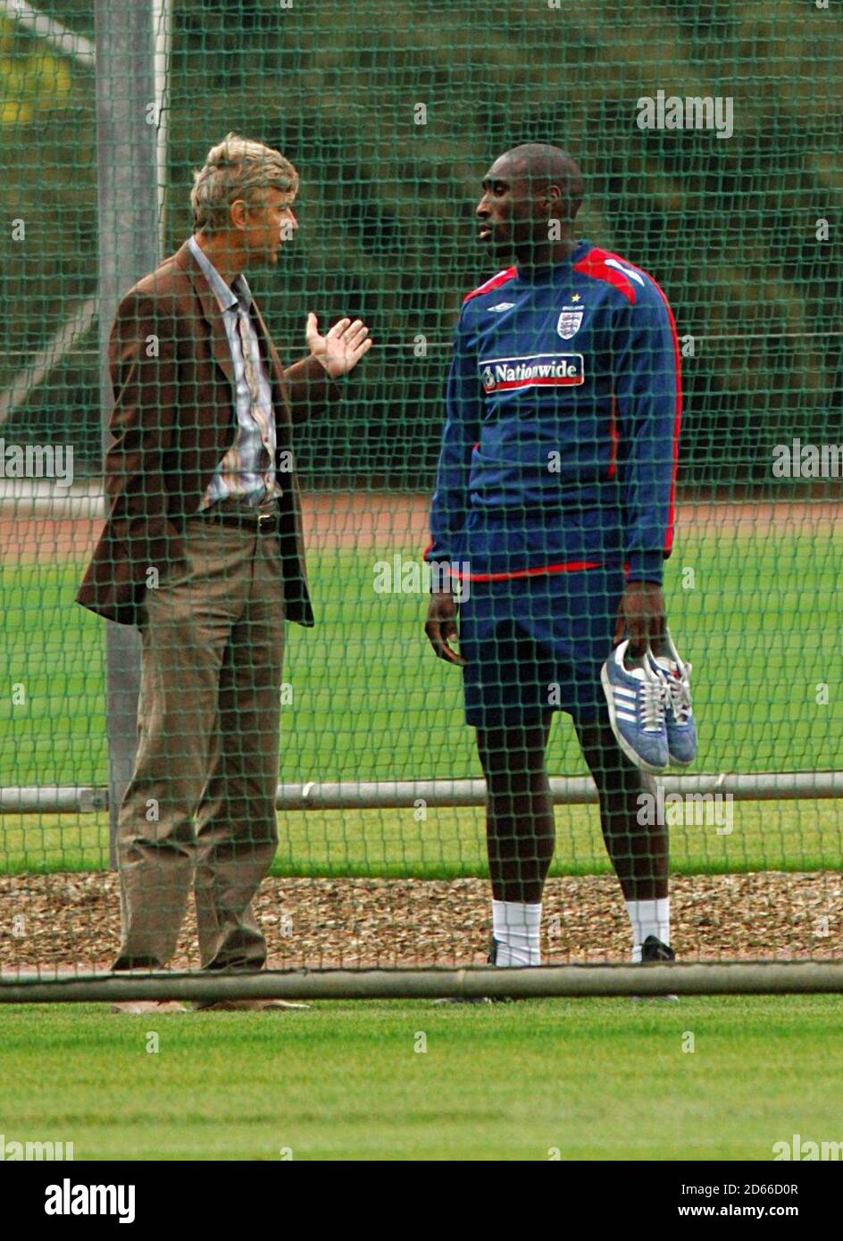 Arsenal manager Arsene Wenger with former Arsenal player and England ...