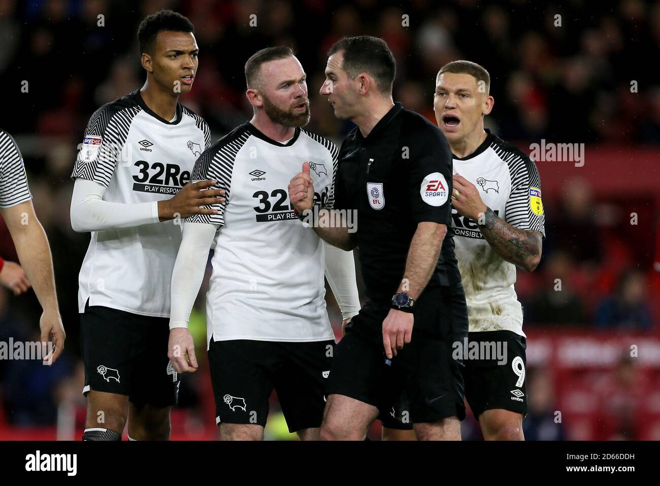 Derby County's Wayne Rooney argues with Referee Tim Robinson Stock ...