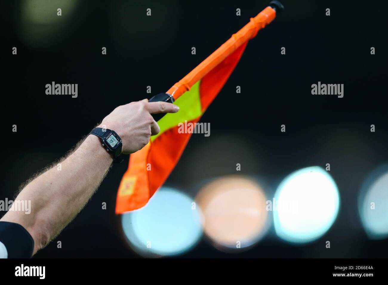 The linesman raises his flag Stock Photo - Alamy