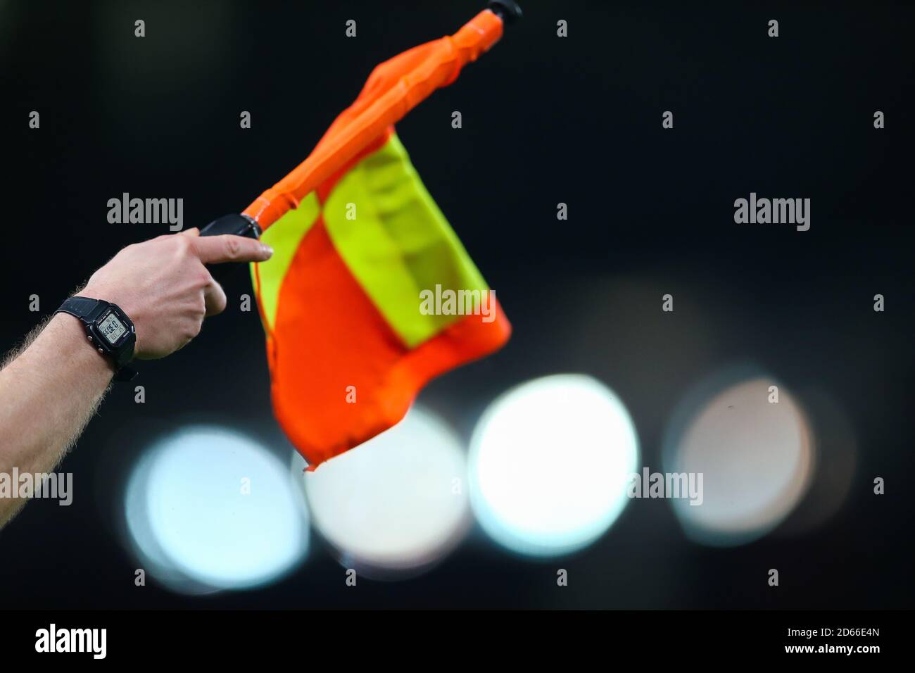The linesman raises his flag Stock Photo - Alamy