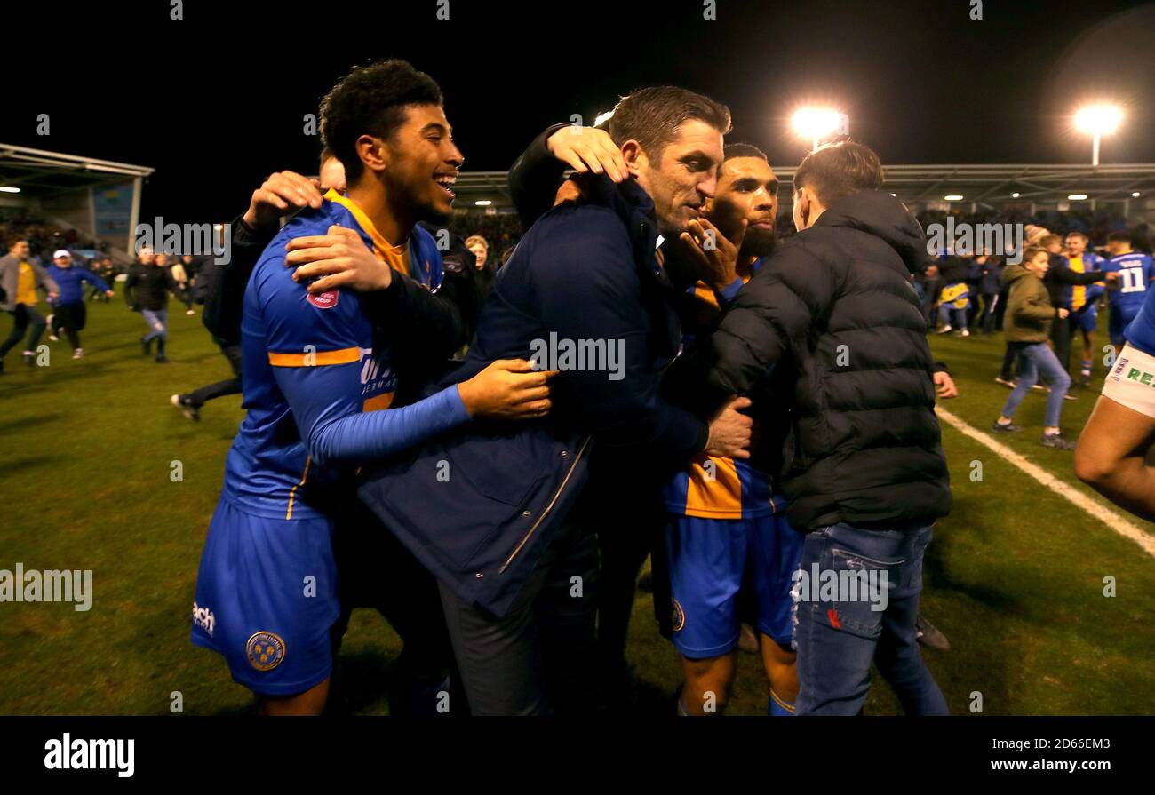 Shrewsbury Town's manager Sam Ricketts (centre) celebrates victory with ...