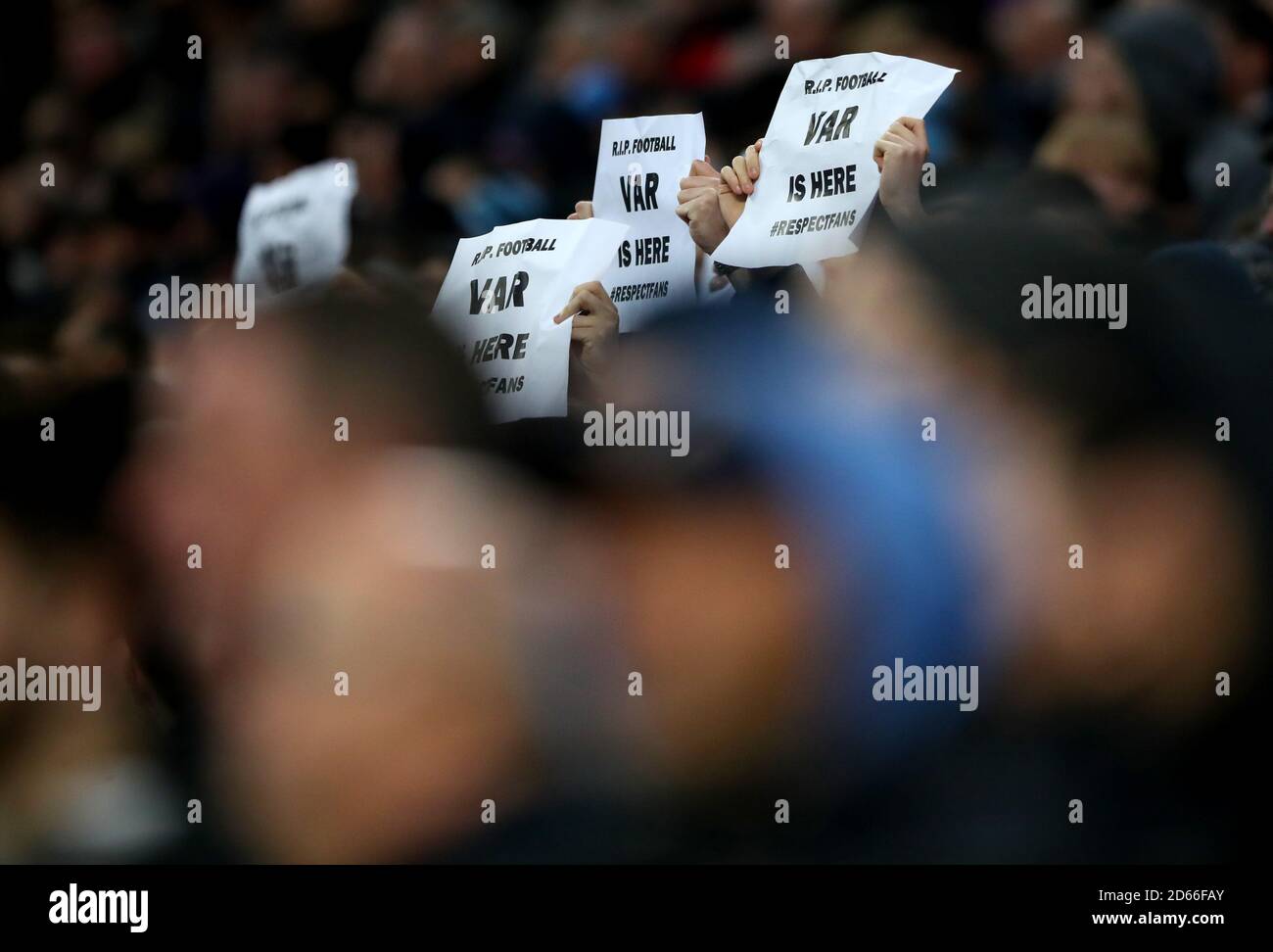 Fans holds signs protesting against VAR in the stands Stock Photo - Alamy