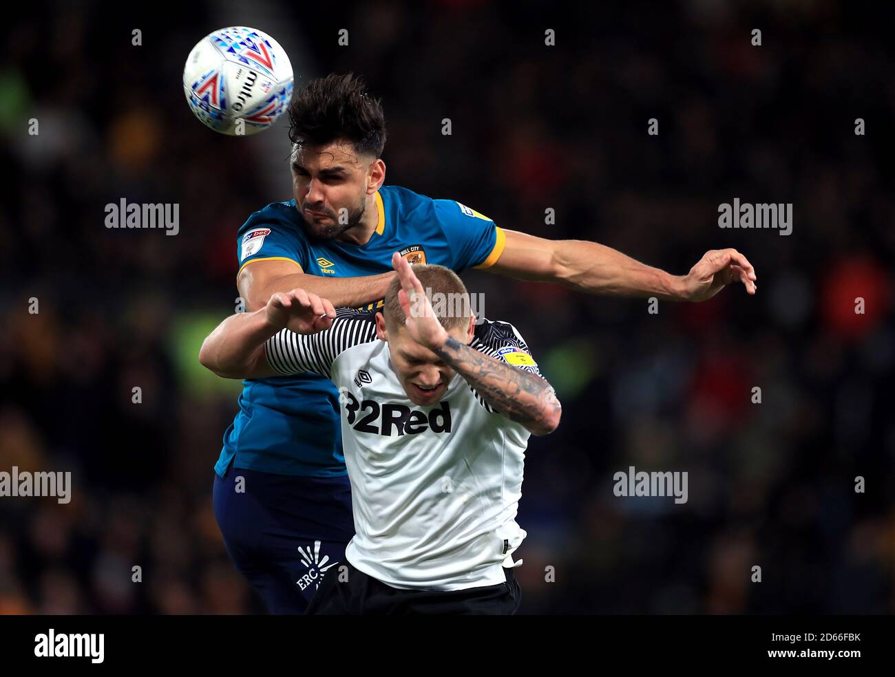 Hull City's Ryan Tafazolli (left) and Derby County's Martyn Waghorn ...