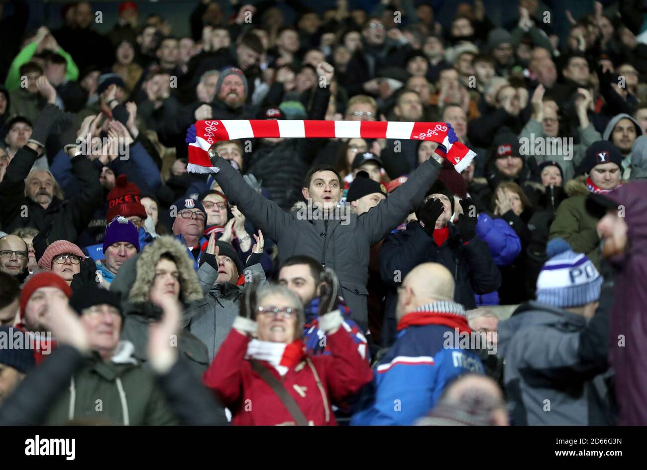 Stoke City fans in the stands Stock Photo - Alamy