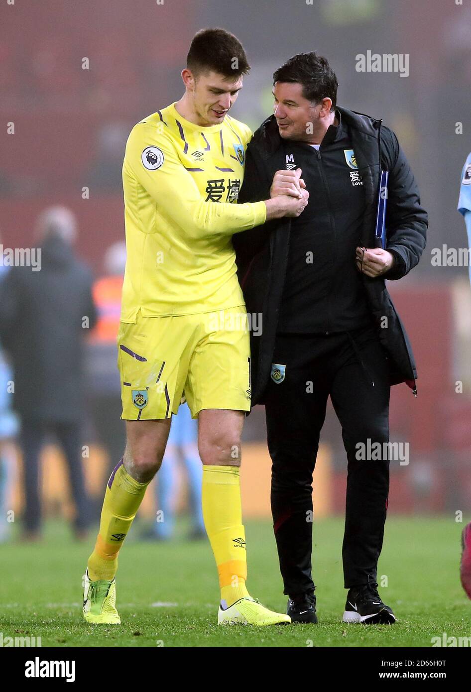 Burnley goalkeeper Nick Pope and goalkeeper coach Billy Mercer (right ...