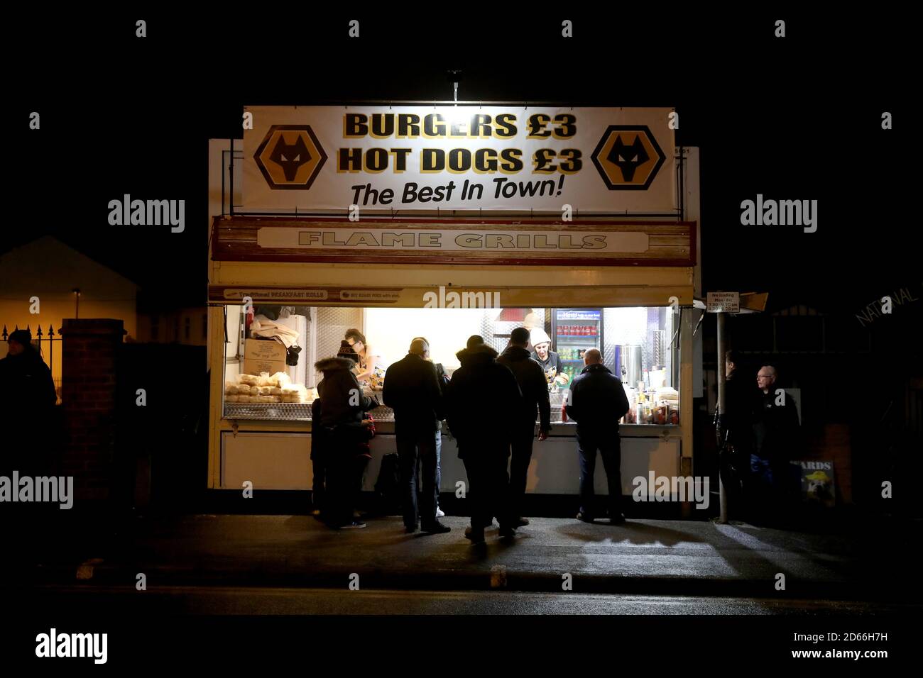 Fans buy refreshments outside the ground Stock Photo - Alamy