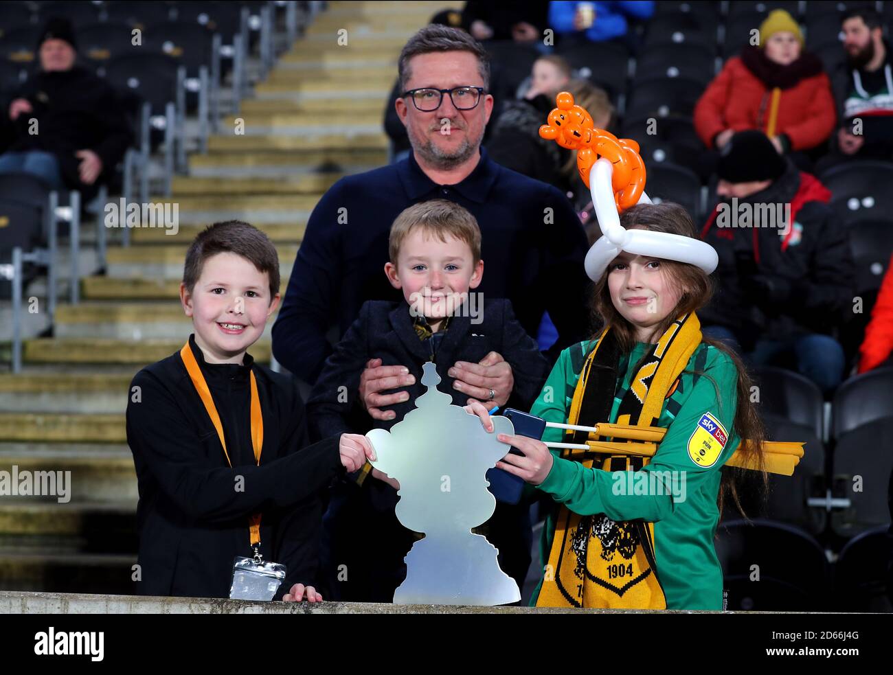 Hull City fans ahead of the game with a cardboard cut out of a trophy ...