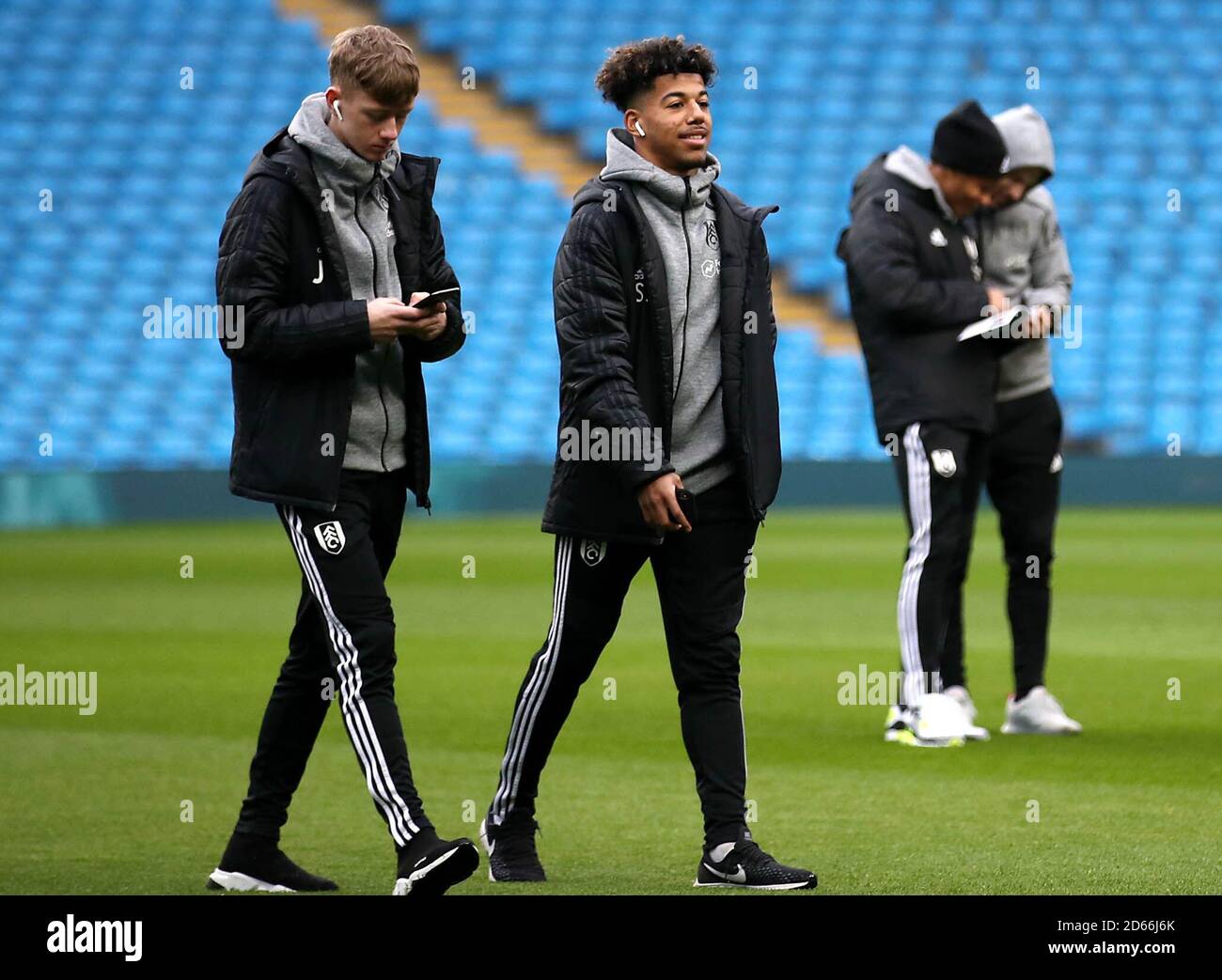 Fulham's Jay Stanfield (left) and Sylvester Jasper inspect the pitch ...