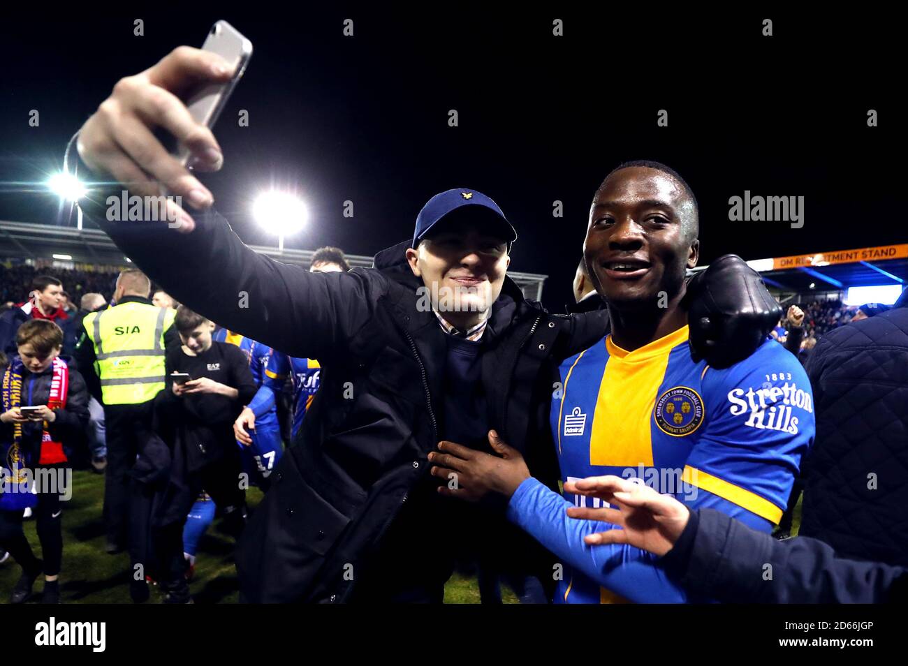 Shrewsbury Town's Daniel Udoh with a fan after the final whistle Stock ...