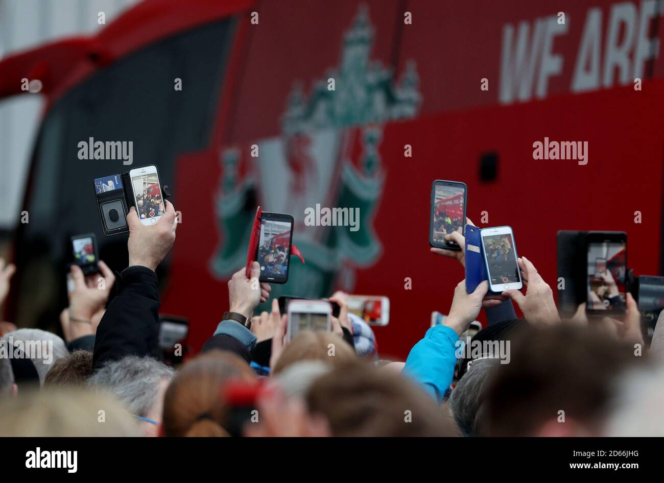Fans film Liverpool's arrival at the ground on their mobile phones ...