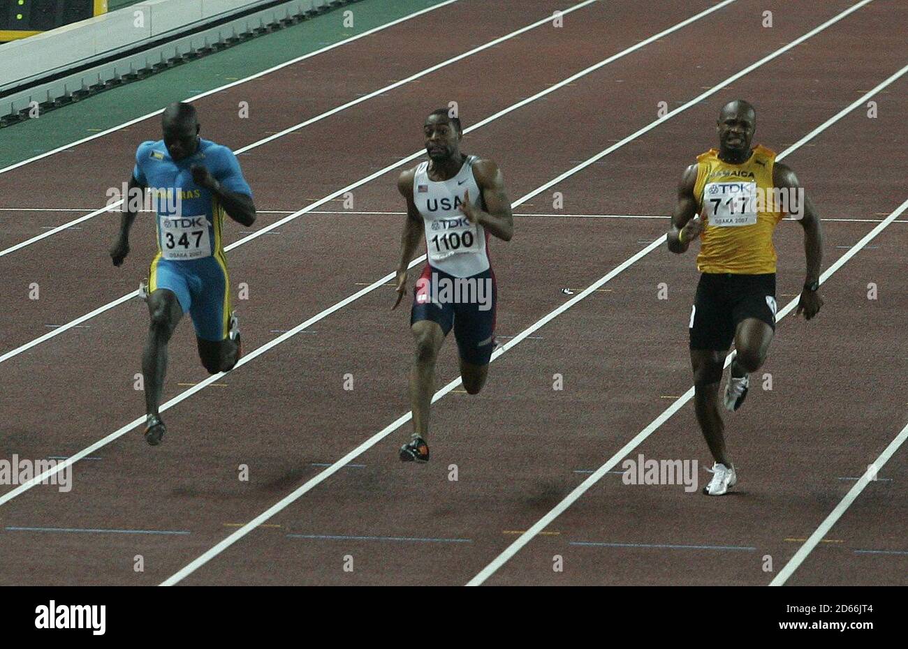USA's Tyson Gay (middle) comes home to win the Men's 100m from Baharmas ...