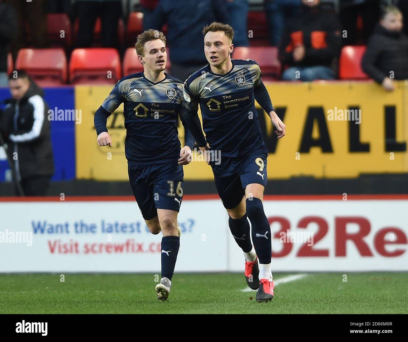 Barnsley's Cauley Woodrow (right) celebrates scoring their first goal ...