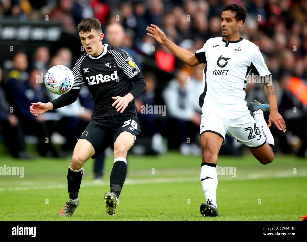 Derby County's Jason Knight (left) and Swansea City's Kyle Naughton ...