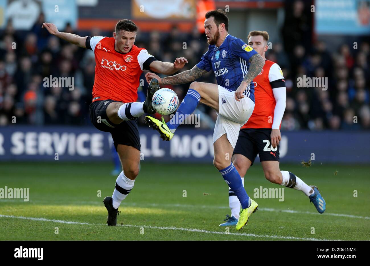 Cardiff City's Lee Tomlin and Luton Town's Matty Pearson battle for the ...
