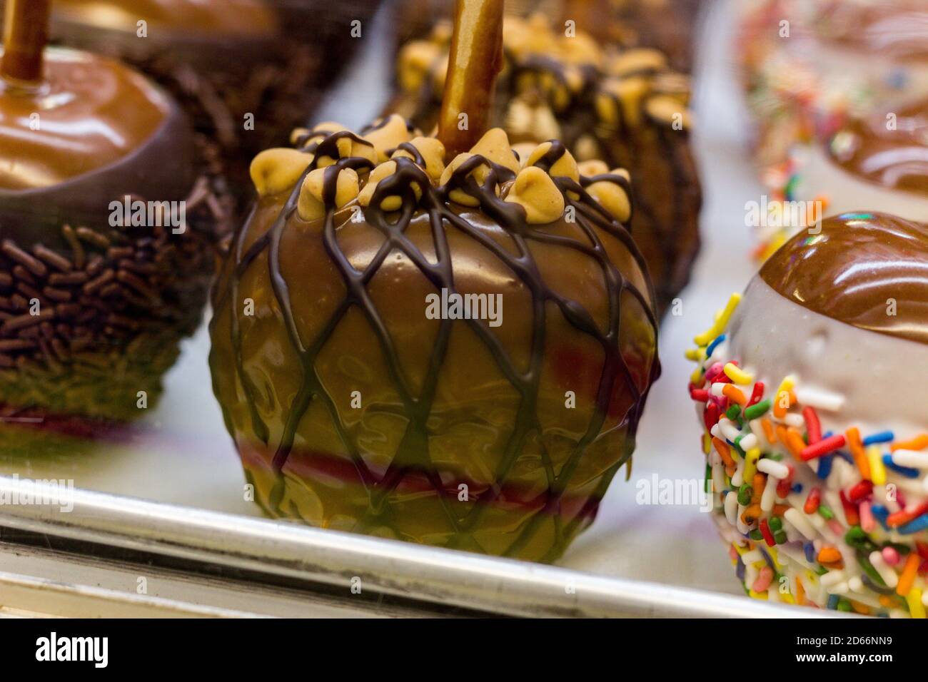 Tray of assorted variety of candy apples at state fair Stock Photo - Alamy
