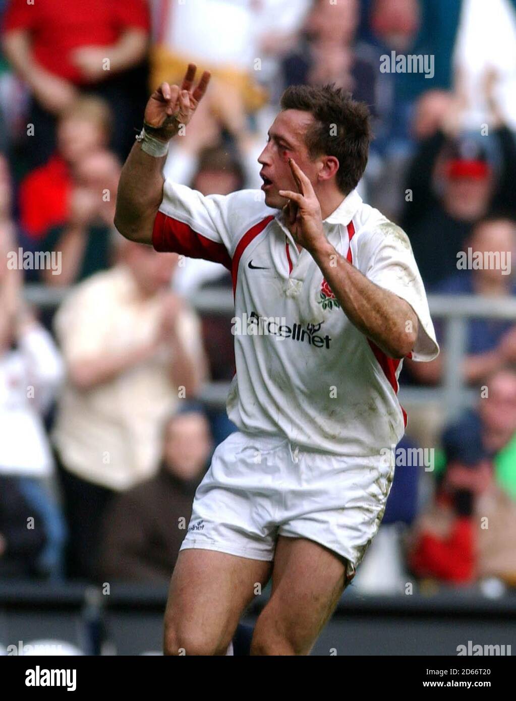 England's Dan Luger celebrates the first of his two trys against Wales ...