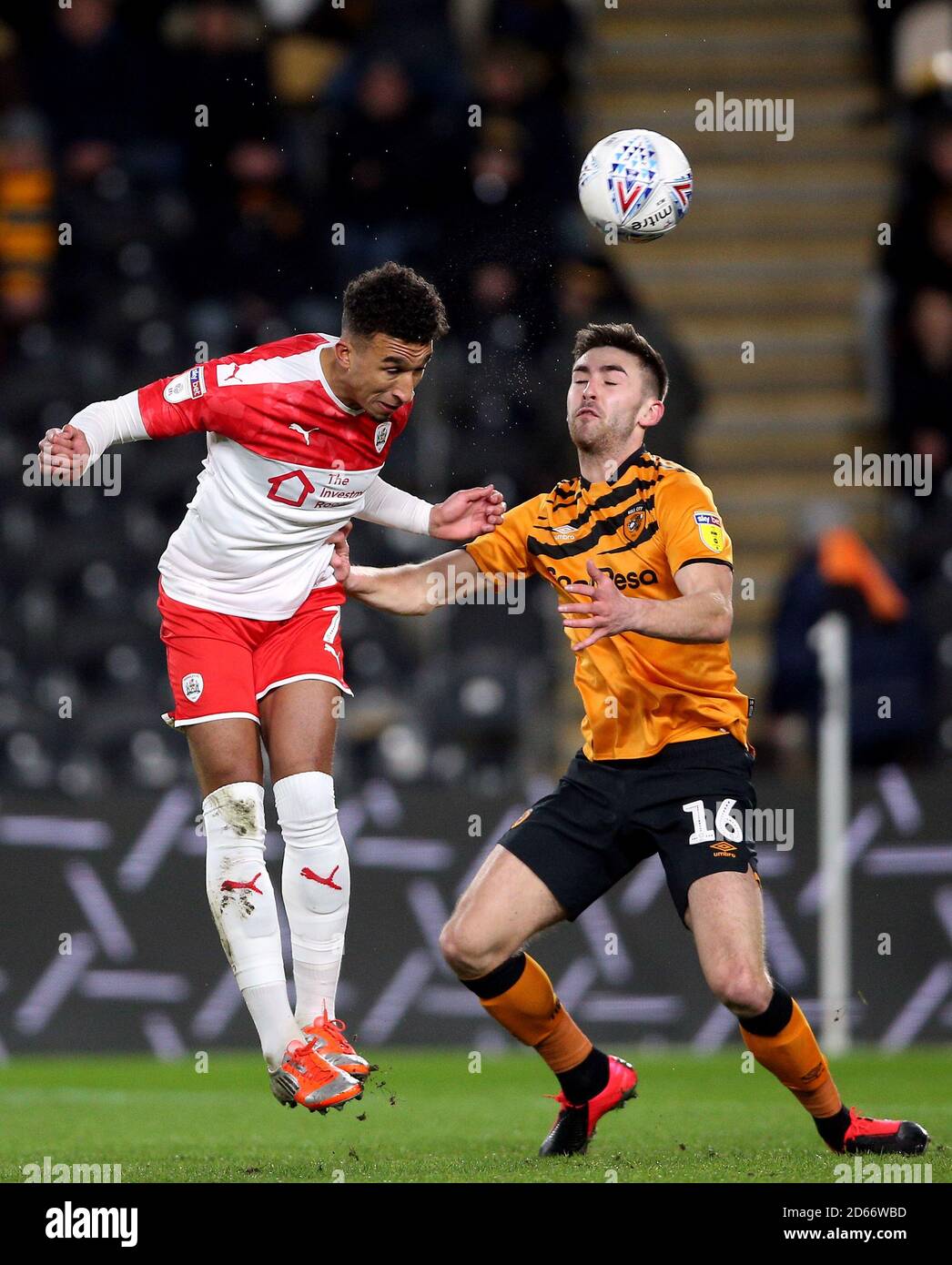 Hull City's Robbie McKenzie (right) and Barnsley's Jacob Brown battle ...