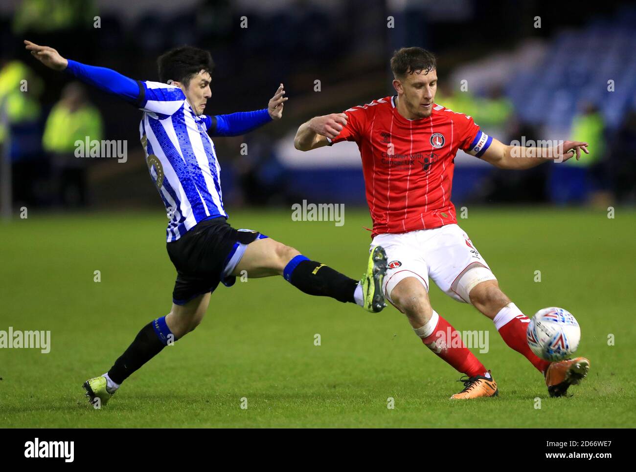 Charlton Athletic's Jason Pearce (left) and Sheffield Wednesday's ...