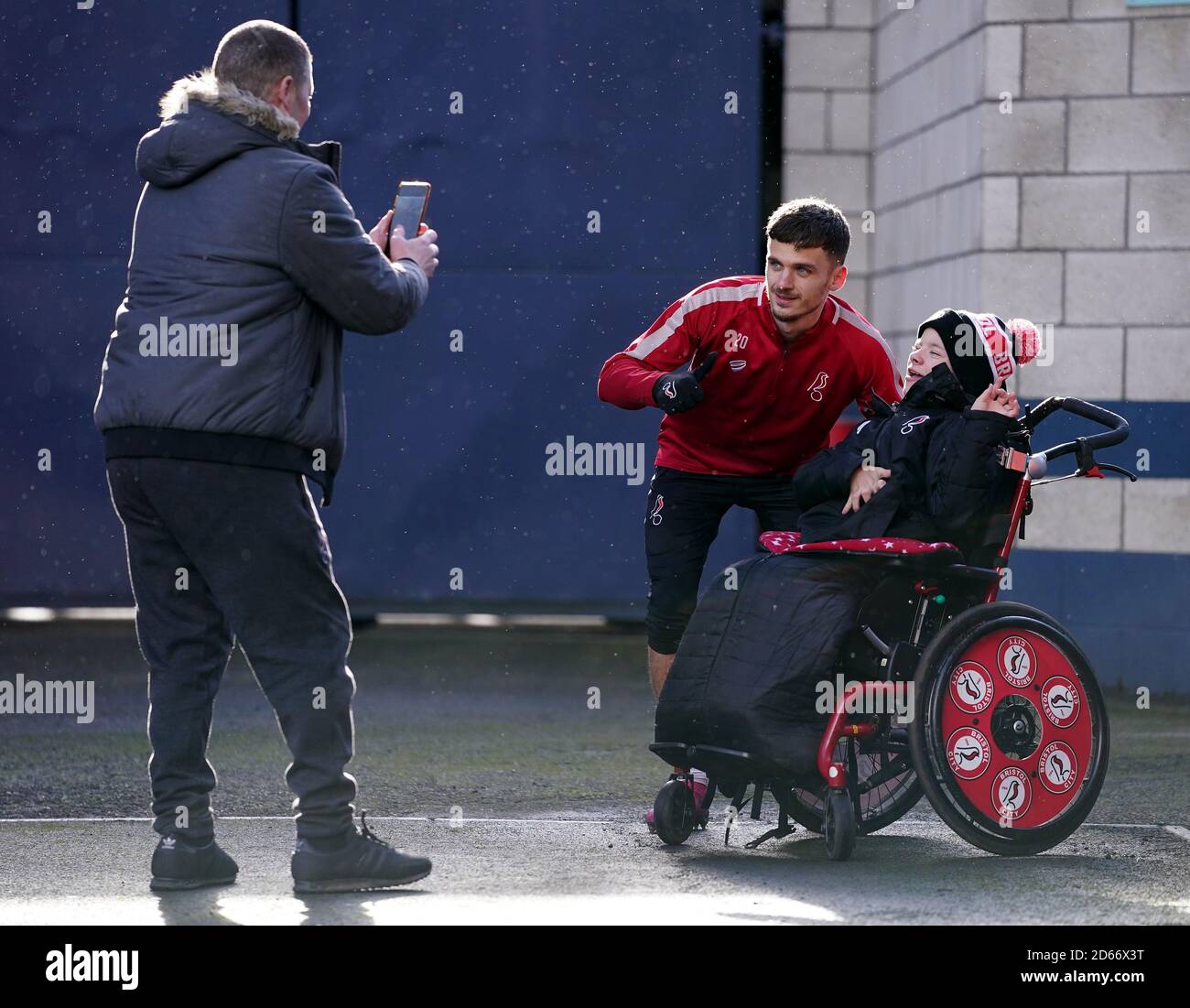 Bristol City's Jamie Paterson poses for a picture with a fan before ...