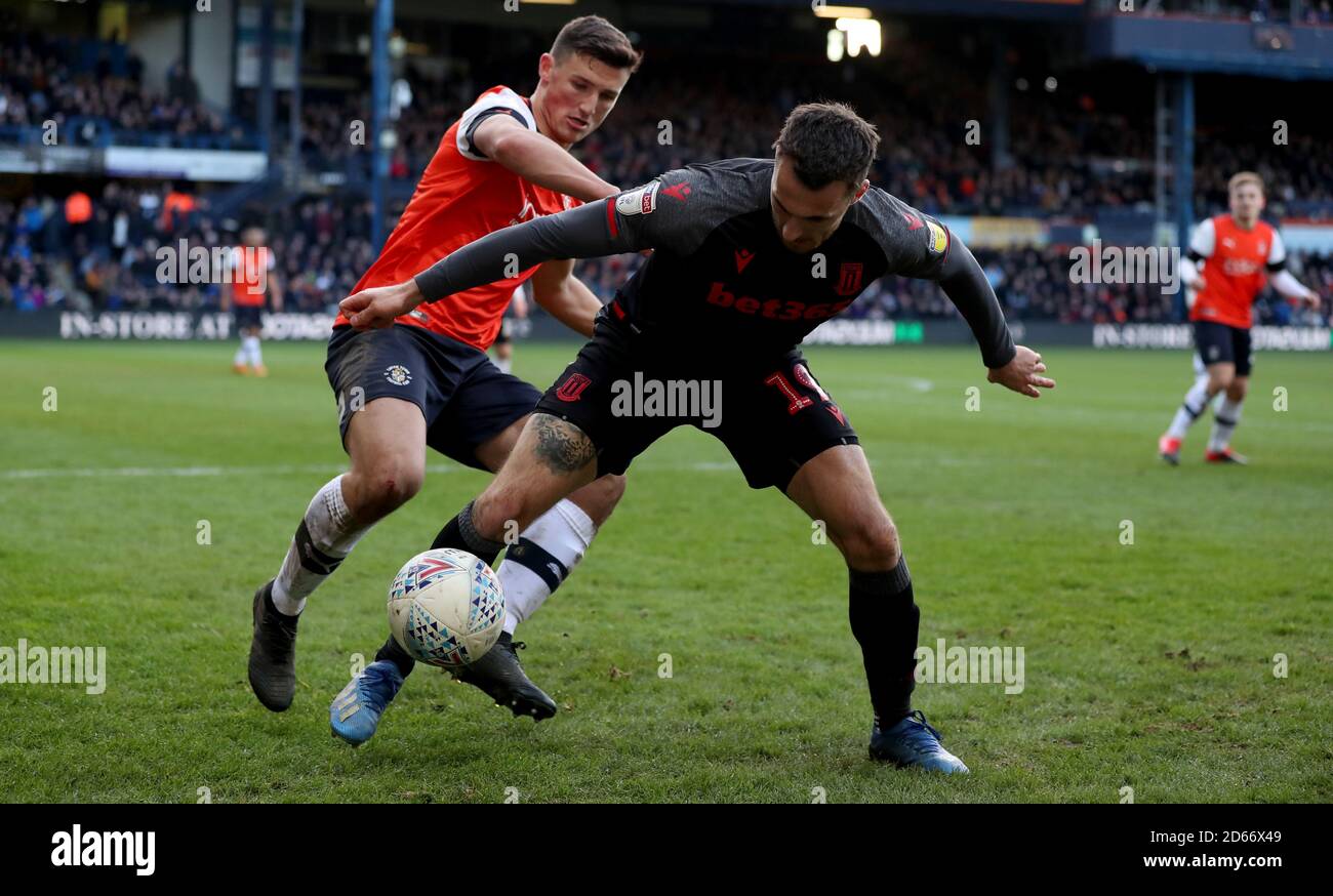Stoke City's Lee Gregory in action with Luton Town's Matty Pearson ...