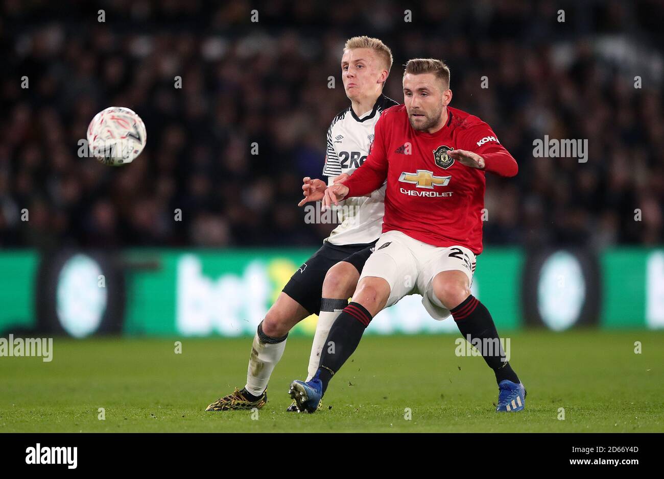 Derby County's Louie Sibley (left) and Manchester United's Luke Shaw ...