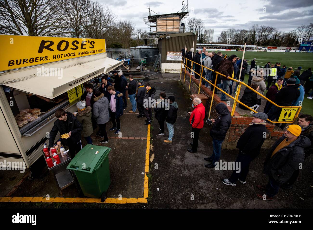 General view of Sutton United fans queuing up for food at half time ...