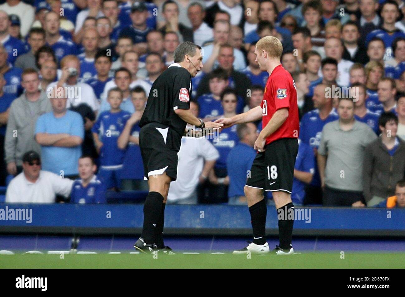 Manchester United's Paul Scholes shakes hands with referee Alan Wiley ...