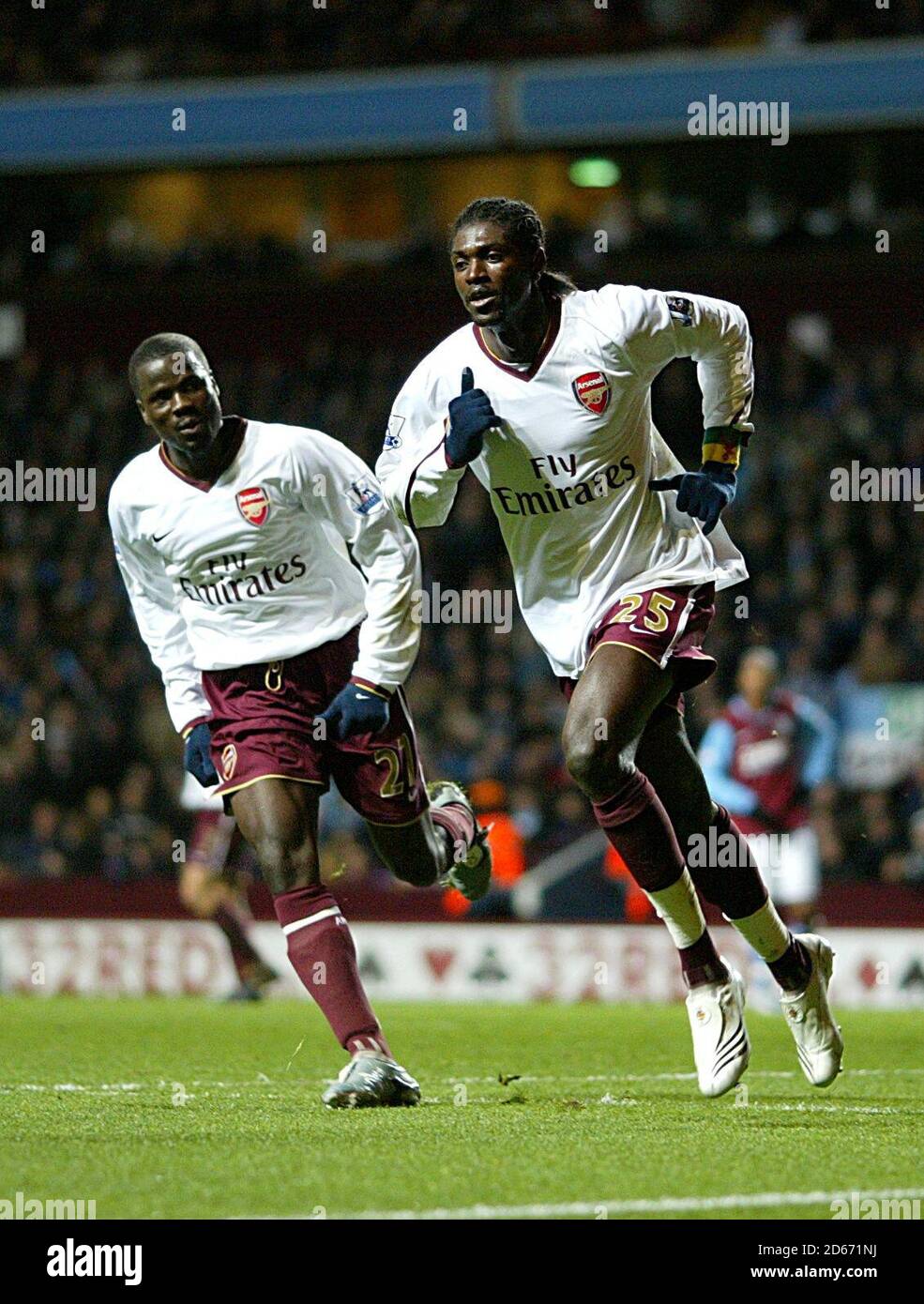 Arsenal's Emmanuel Adebayor (right) celebrates scoring his sides second ...