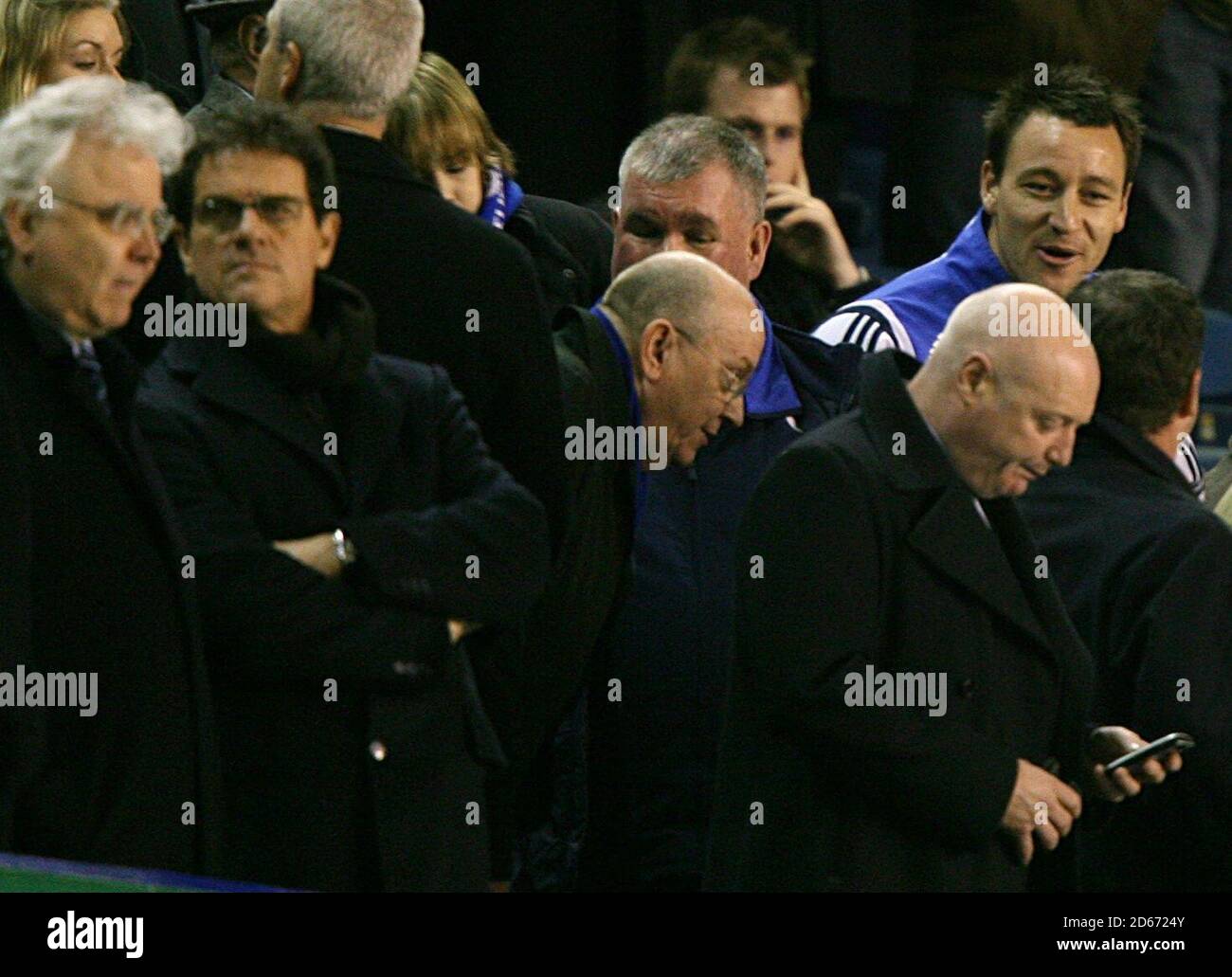 England manager Fabio Capello in the stands with Chelsea's John Terry ...