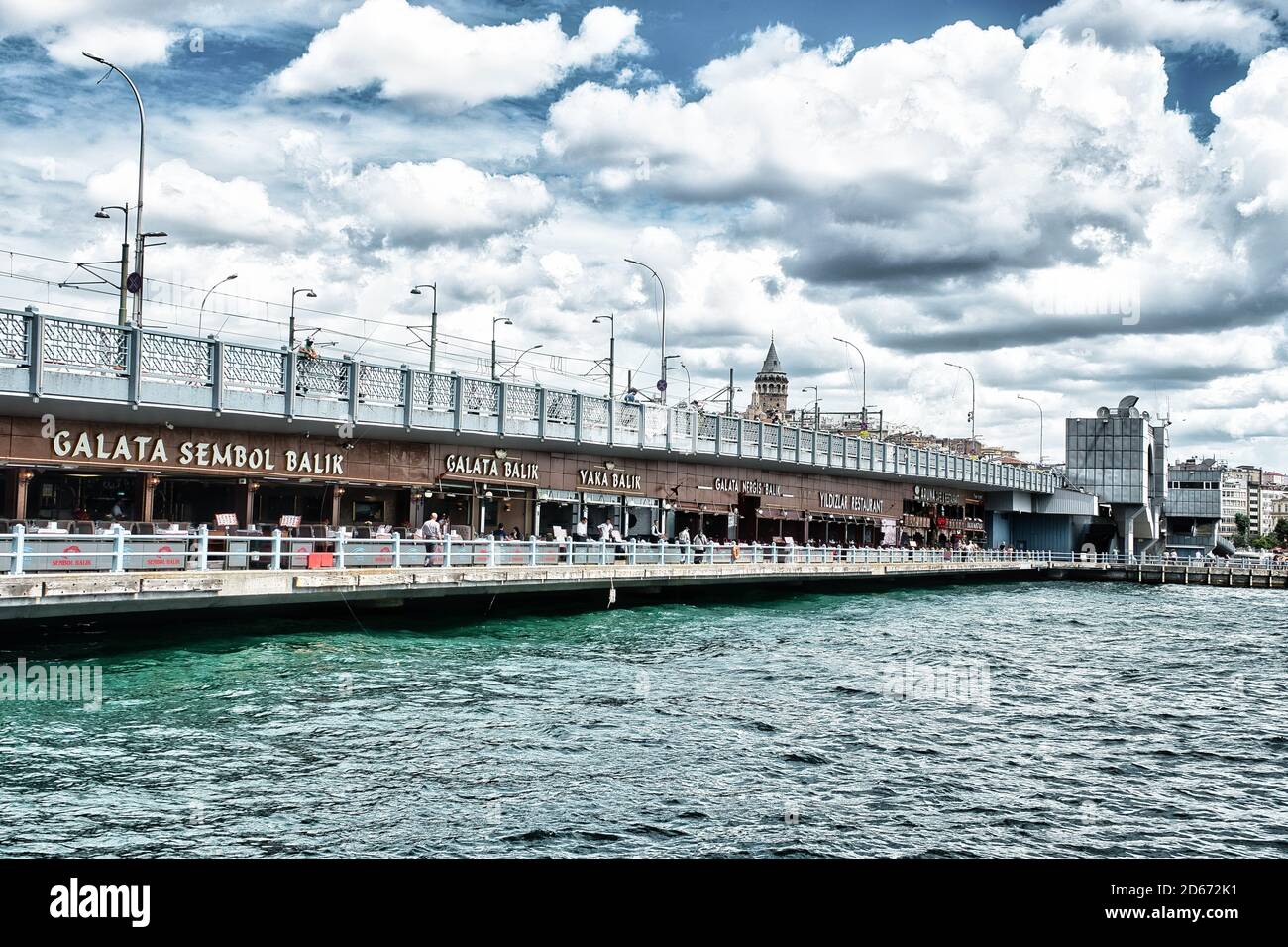 Long bridge with lots of shops under it and a pathway in the city Stock ...