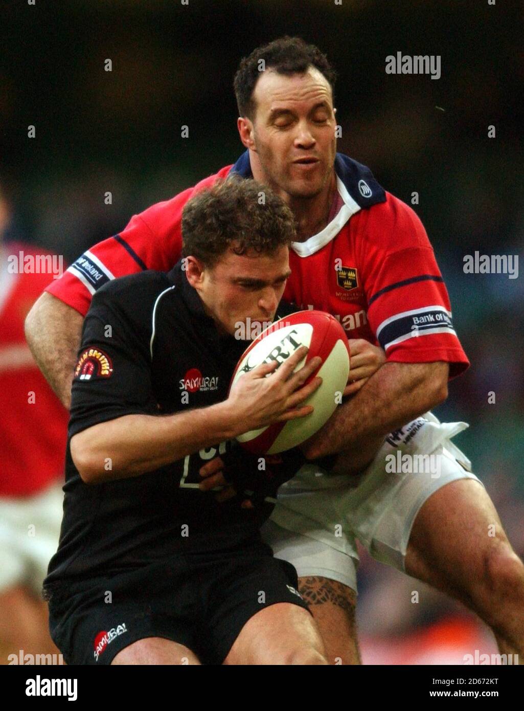 Mike Mullins of Munster tackles Neath's Adrian Durston Stock Photo - Alamy