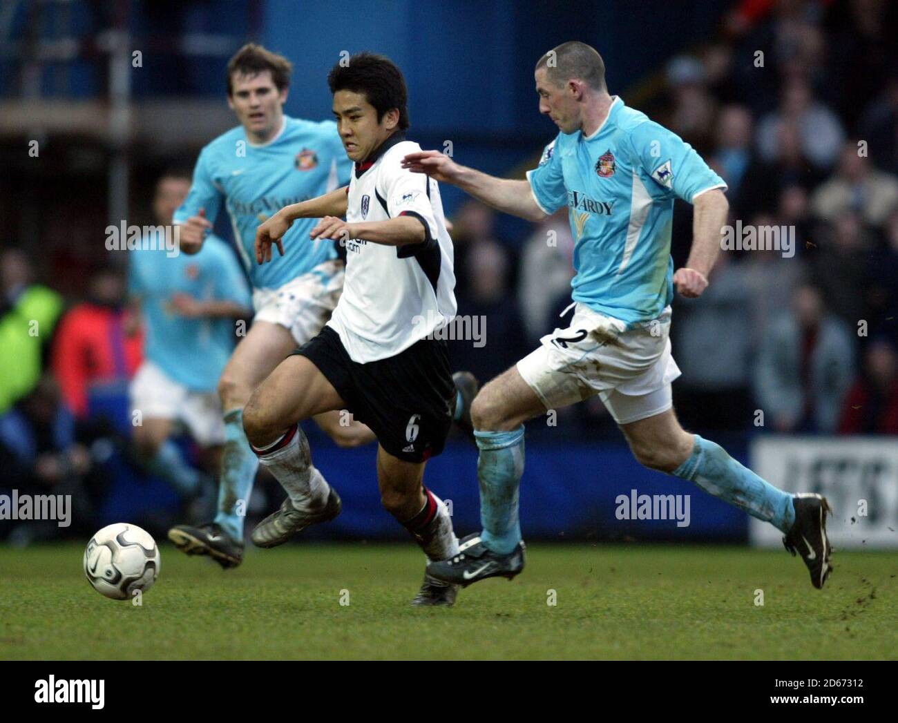 Fulham's Junichi Inamoto and Sunderland's Stephen Wright battle for the ...