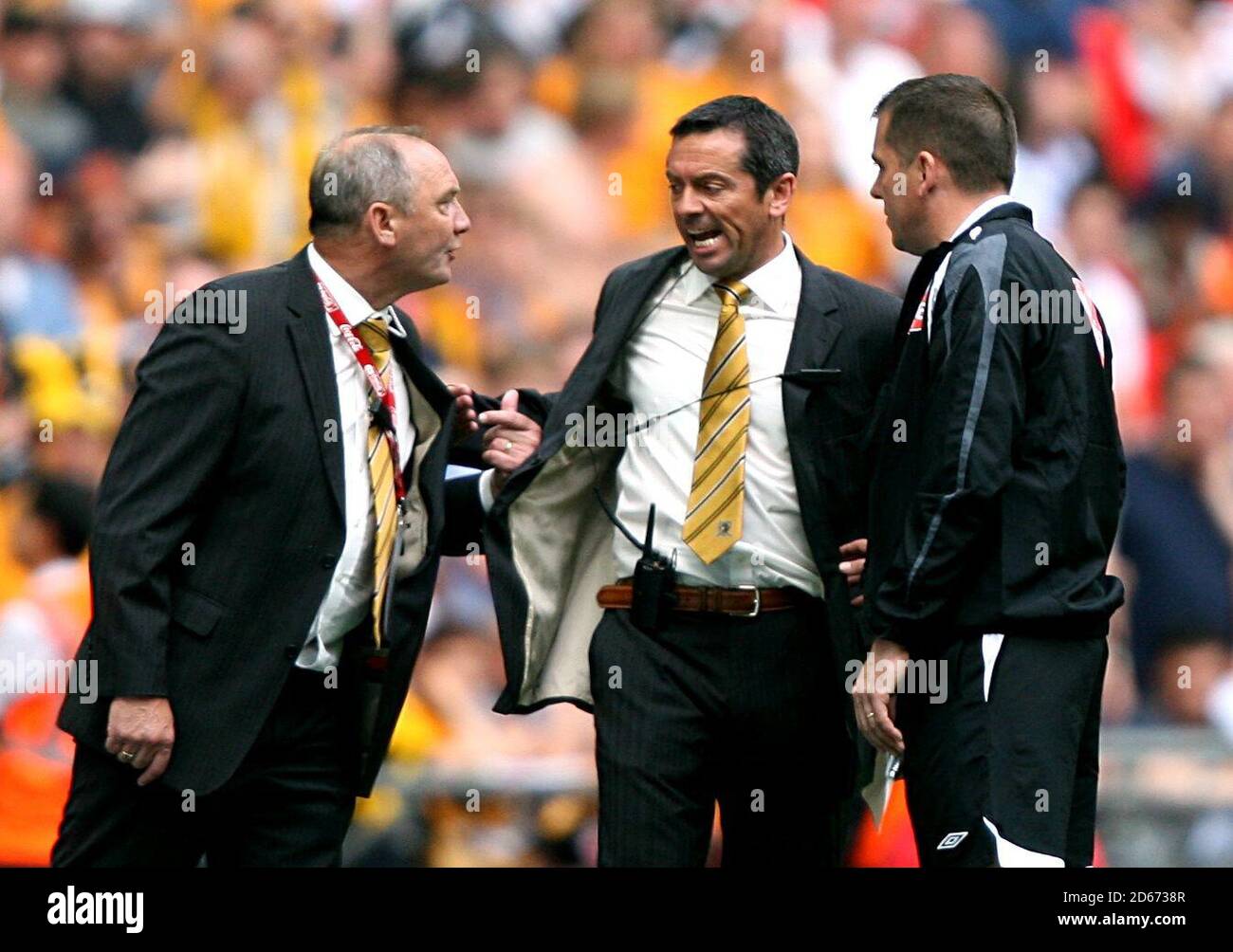 Hull manager Phil Brown (centre) has an argument with his assistant ...