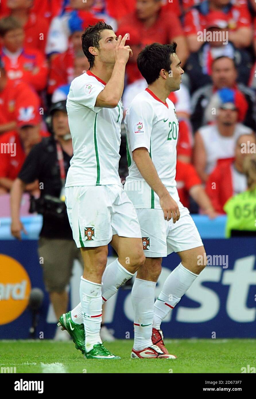 Portugal's Cristiano Ronaldo (left) celebrates with team mate Anderson ...