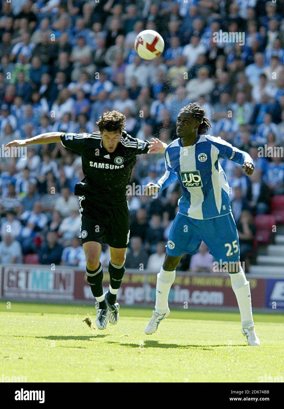 Chelsea's Michael Ballack and Wigan Athletic's Mario Melchiot battle ...