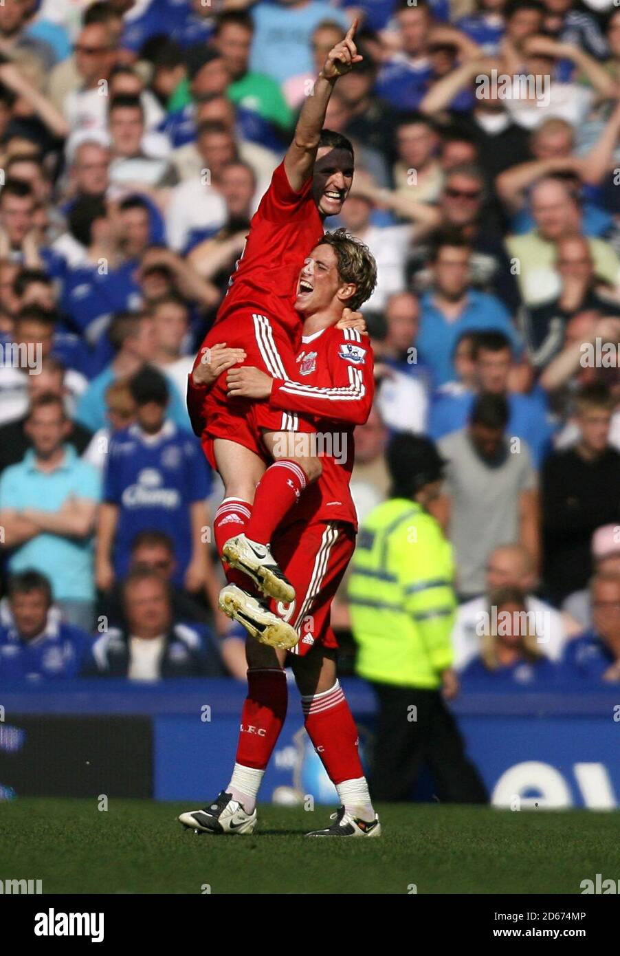 Liverpool's Fernando Torres (right) celebrates with his team-mate ...