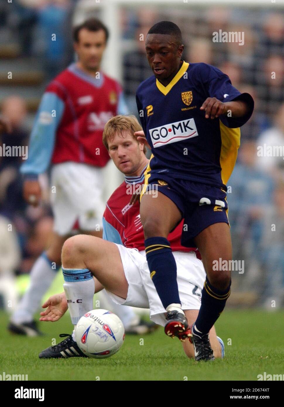 Wimbledon's Michael Gordon and Burnley's Andy Todd battle for the ball ...