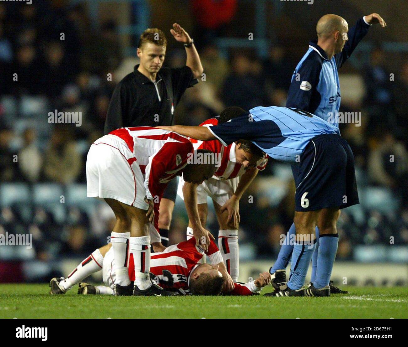 Sunderland's Colin Healy lies motionless on the turf after a heavy ...