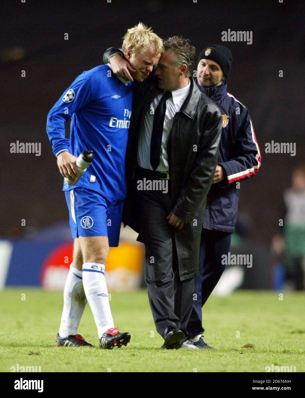 Chelseas eidur gudjohnsen is consoled by monacos coach didier deschamps ...