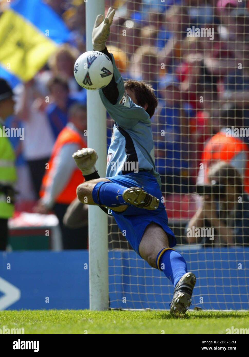 Shrewsbury Town's goalkeeper Scott Howie makes a save during the ...