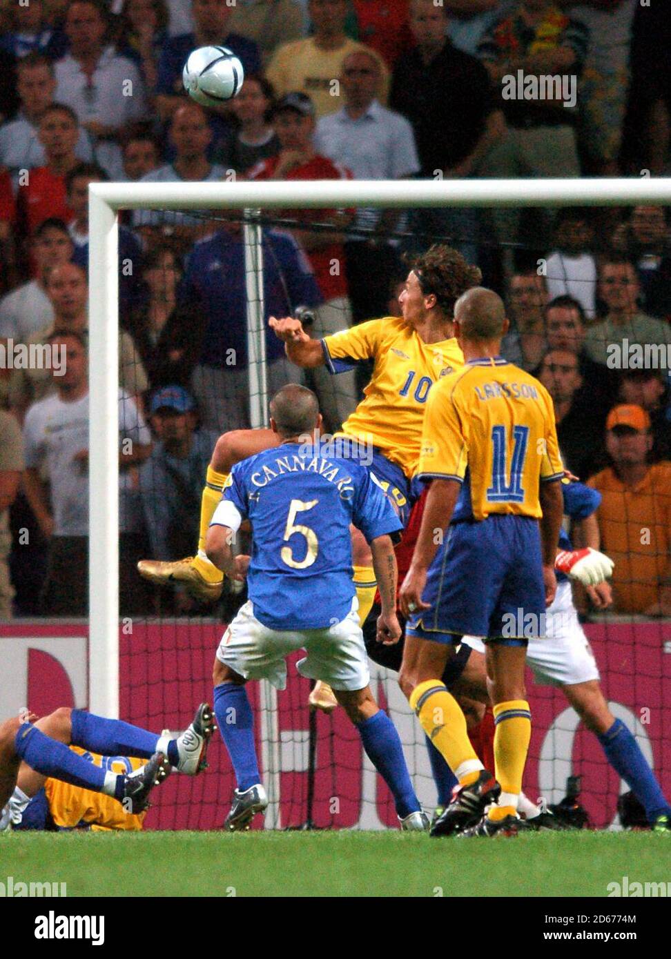 Sweden's Zlatan Ibrahimovic flicks the ball over Italy's goalkeeper ...