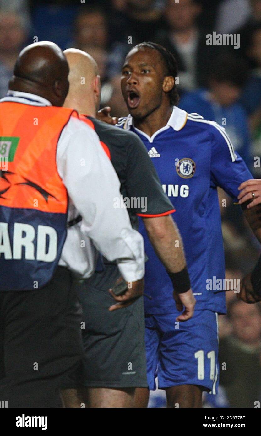 Chelsea's Didier Drogba (right) shows his frustration towards referee ...