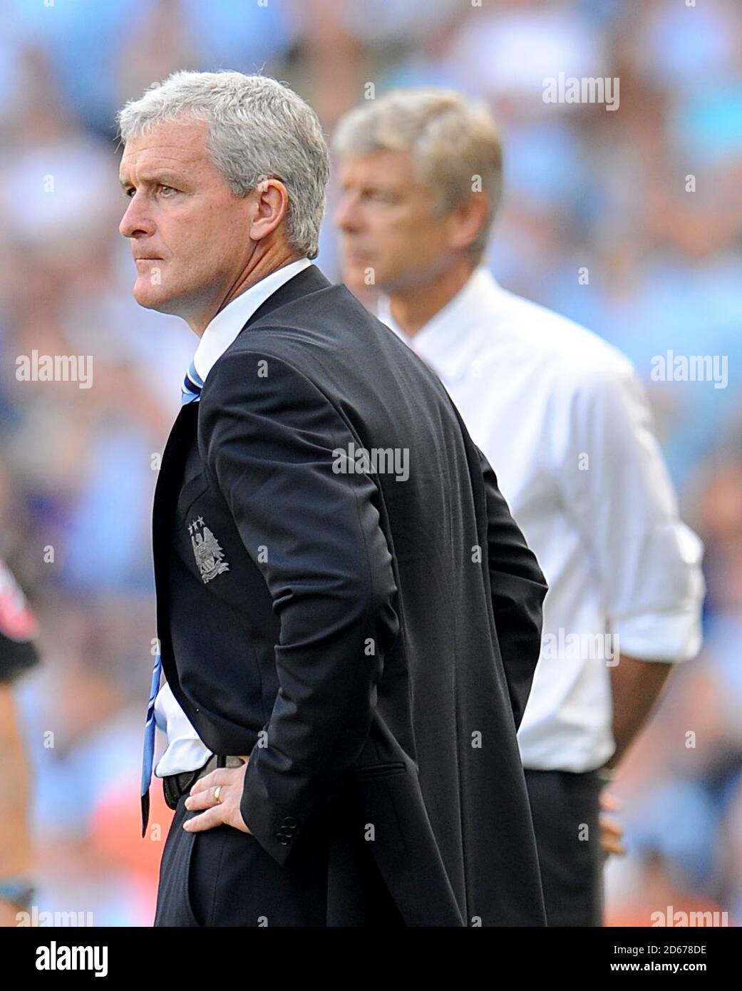 Manchester City manager Mark Hughes and Arsenal manager Arsene Wenger ...