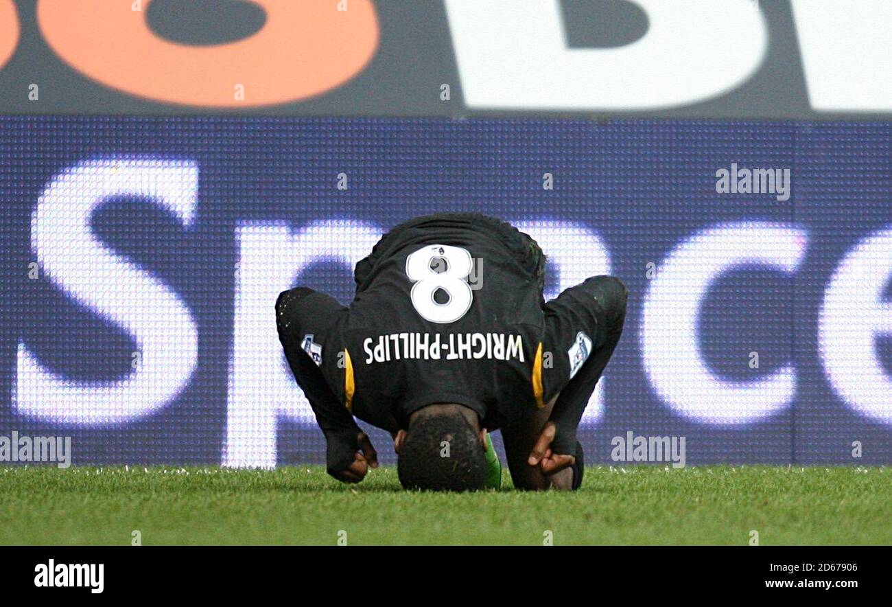 Manchester City's Shaun Wright-Phillips looks in pain after taking a ...